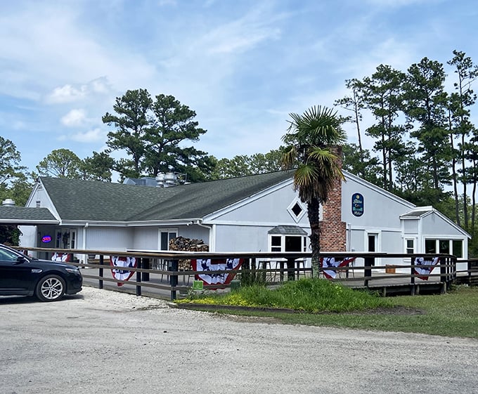 Tucked among the pines like a secret fishing cabin, this waterside gem serves seafood with a view worth the drive.