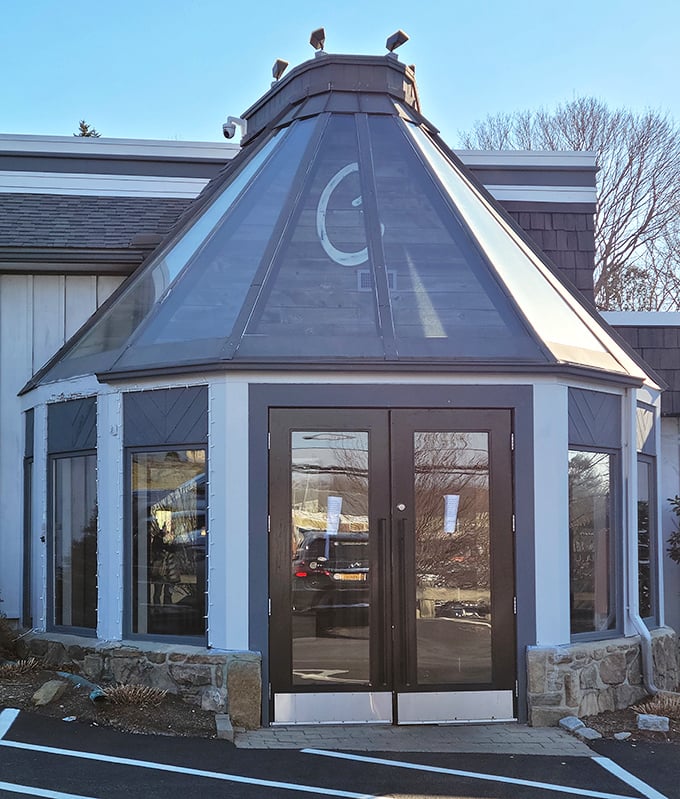 The Chophouse Grille's distinctive glass entrance pavilion &ndash; architectural proof that good taste extends beyond just their steaks.