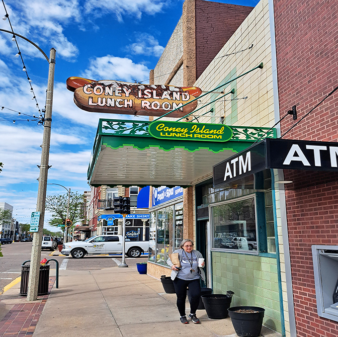 That vintage wooden hot dog sign has been guiding hungry folks to Coney Island Lunch Room for generations of deliciousness.