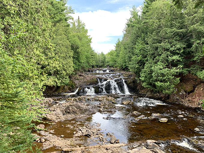 Copper Falls' liquid staircase tumbles through a forest so lush, you'll swear you've wandered onto Jurassic Park's set.