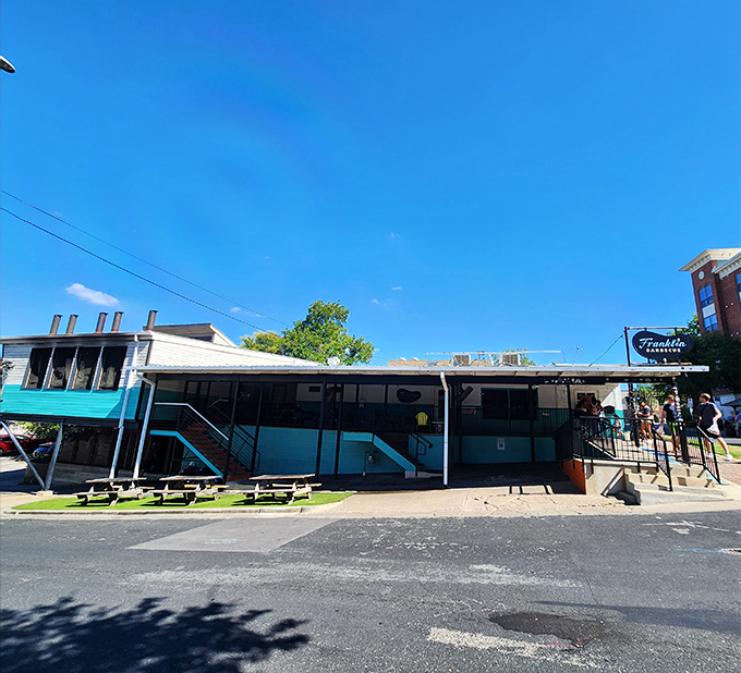 Franklin's teal exterior stands out like a barbecue oasis. That simple awning has sheltered hopeful diners through sunshine and rain.