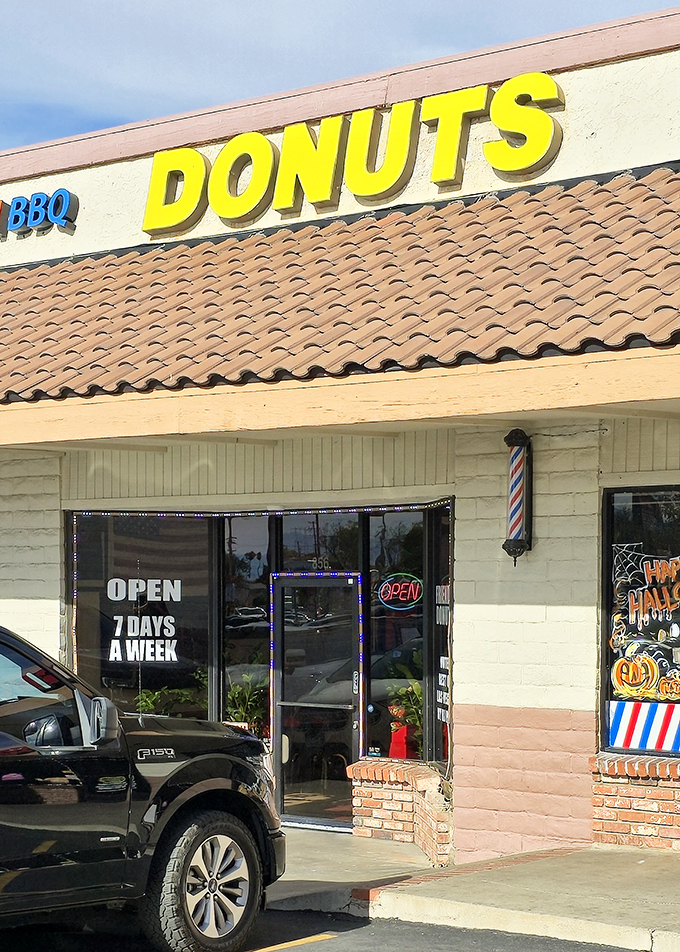 Yellow letters of joy hovering above brick and mortar! Friendly Donut House delivers on its name with a warm Henderson welcome and Halloween spirit.
