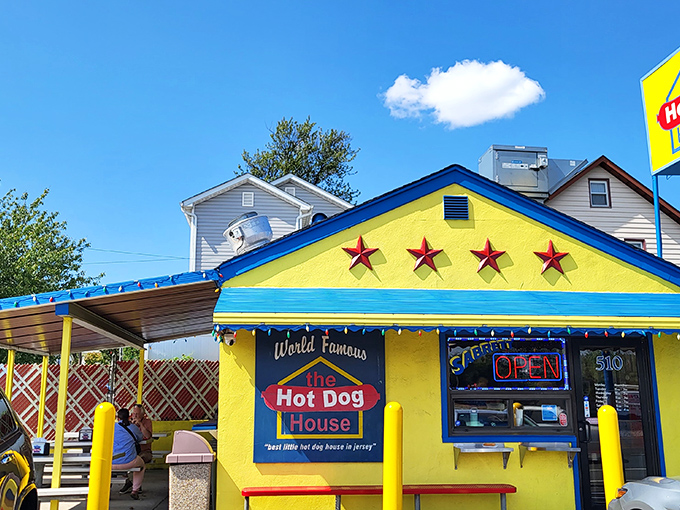 Sunshine yellow with red stars&mdash;this hot dog stand looks like it was designed by a happy child with excellent taste.