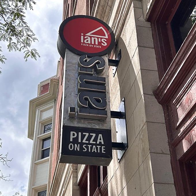 Ian's vertical sign stands tall on State Street, a pizza landmark in a sea of campus eateries.