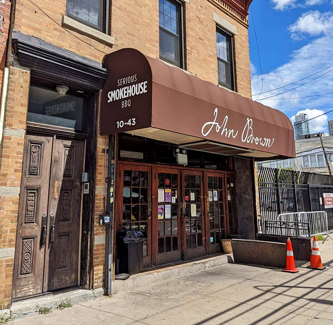 Serious by name, serious by flavor! John Brown's carved wooden doors open to a world where smoke transforms humble cuts into melt-in-your-mouth masterpieces.