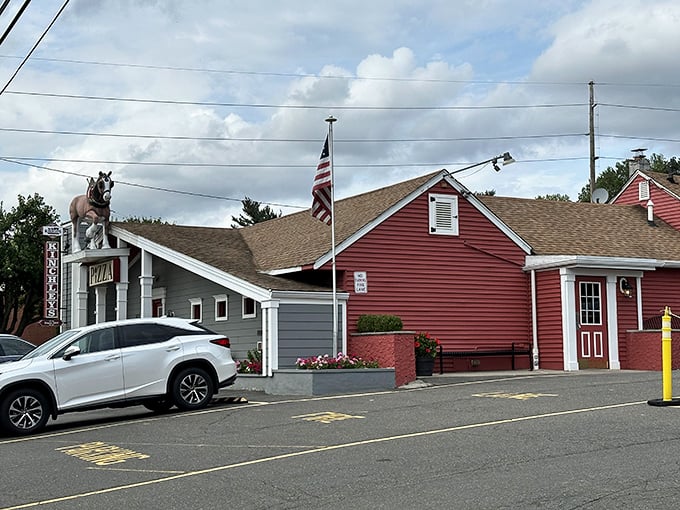 Kinchley's red barn exterior suggests country charm, but the pizza inside is pure tavern perfection.
