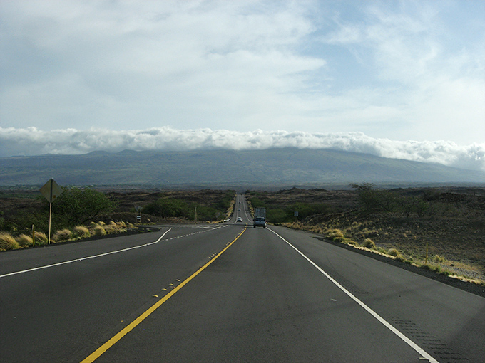 The road to tomorrow! Kohala Mountain Road stretches toward distant peaks like a runway for cloud-jumping, with scenery straight out of Jurassic Park.
