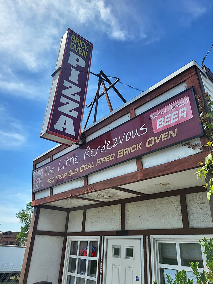 Little Rendezvous' vintage sign is practically a historical landmark. That "120 YEAR OLD COAL FIRED BRICK OVEN" isn't just a claim&mdash;it's pizza archaeology.