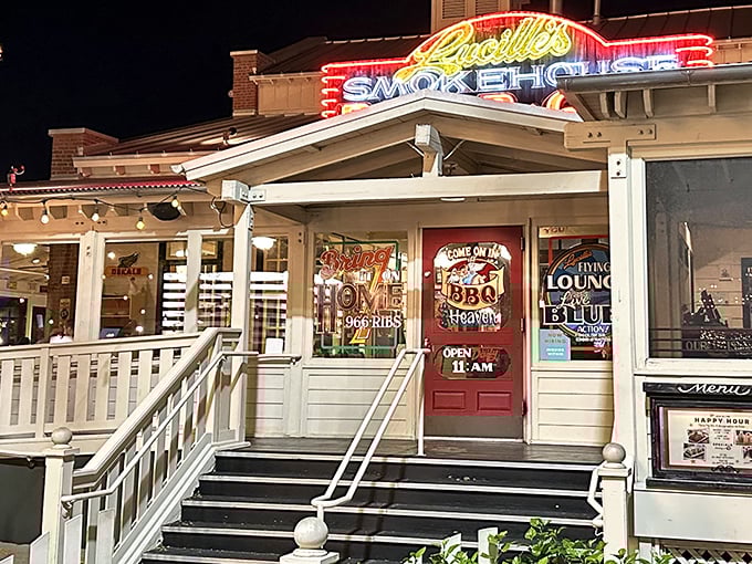 Lucille's neon-lit porch practically whispers "come on in" to BBQ heaven, and who are we to refuse?