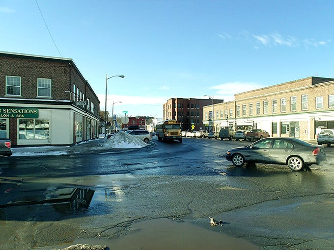 Lyndonville's winter-ready downtown proves that affordable Vermont living comes with practical amenities and occasional puddles.