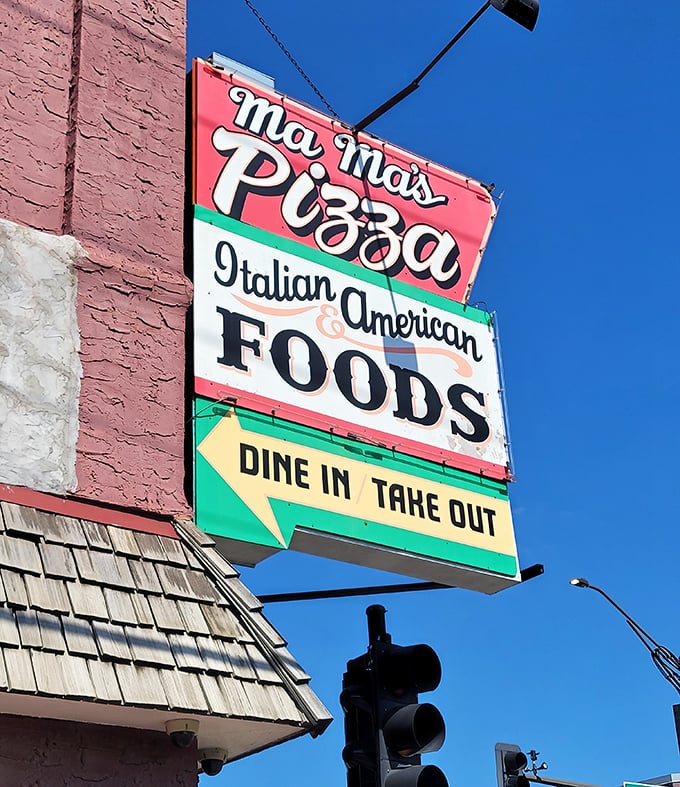 Mama's vintage neon sign glows like a beacon for pizza pilgrims seeking authentic comfort.