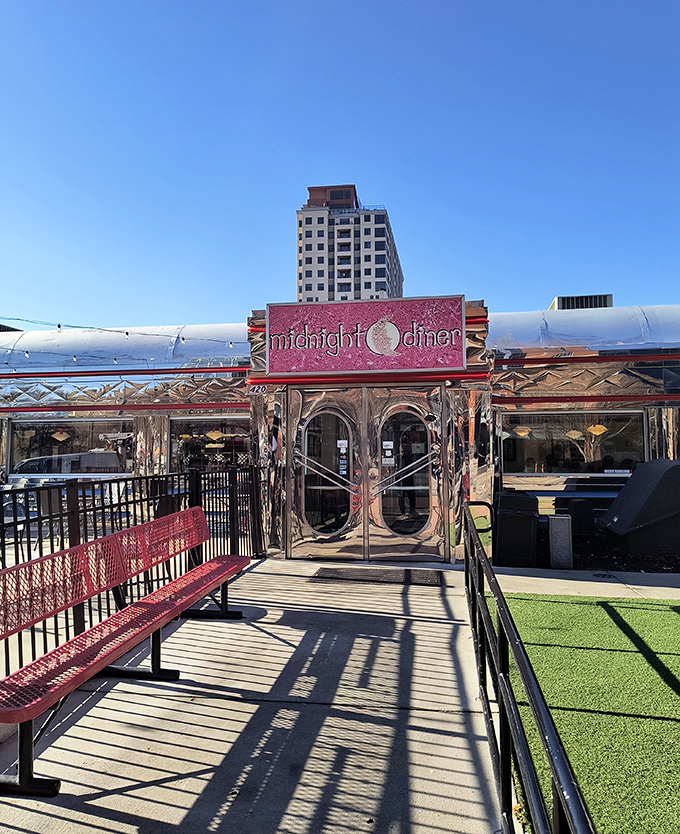 Midnight Diner's gleaming silver exterior shines like a breakfast beacon in Charlotte's cityscape, promising 24-hour comfort food bliss.
