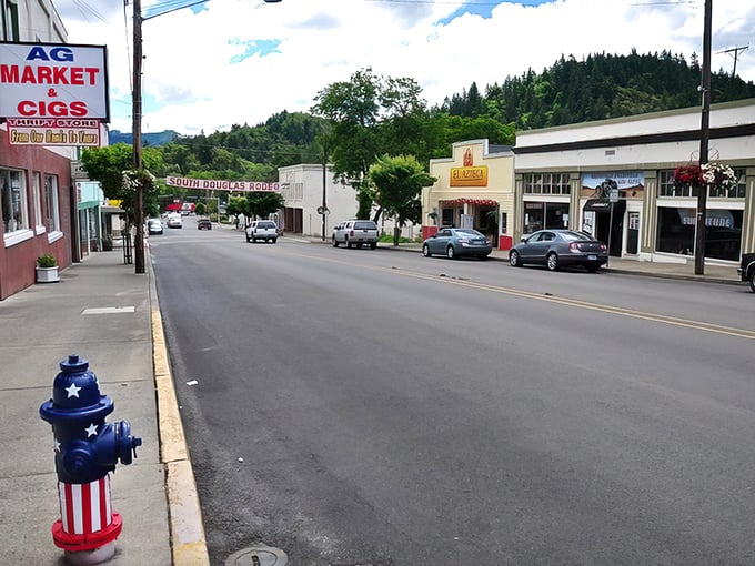 Even the fire hydrant dresses patriotically in Myrtle Creek, where small-town America comes with small-town price tags.