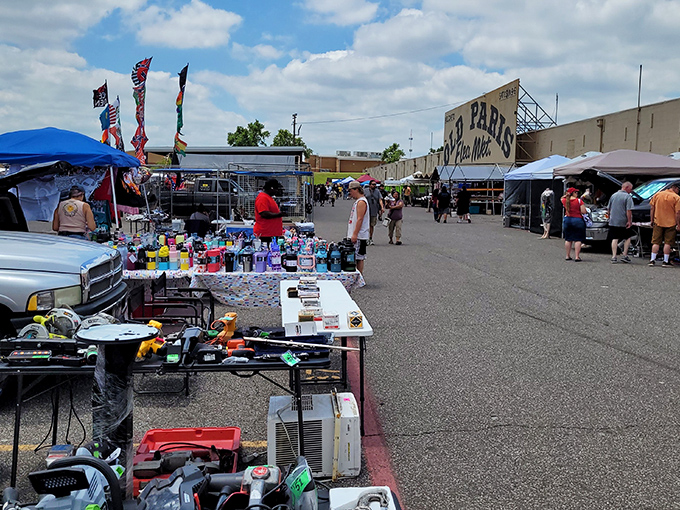 Old Paris Flea Market brings European charm to OKC! Outdoor vendors create a festive atmosphere under colorful flags and Oklahoma sunshine.