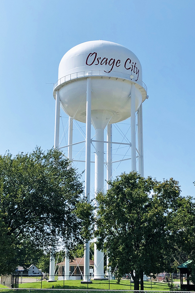 The iconic Osage City water tower stands tall, a landmark in a town where your retirement dollars stand equally tall against the cost of living.