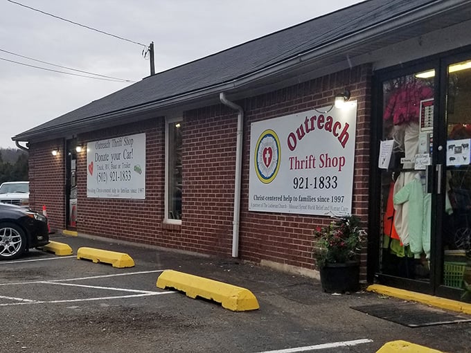 The Outreach Thrift Shop's brick facade and cheerful yellow parking bumpers welcome bargain hunters with open arms.