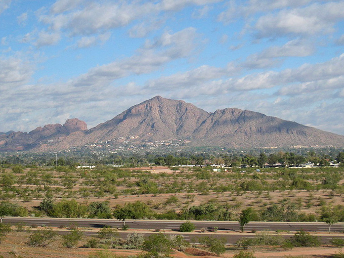 Camelback Mountain stands sentinel over Paradise Valley like nature's own security guard. Million-dollar views that come standard with every home!