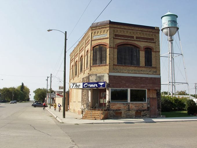 Pembina's historic corner building anchors the town with solid dignity. That water tower in the distance is practically a local celebrity!