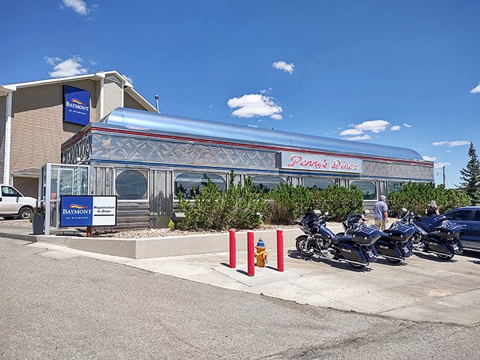 That classic silver diner car design screams 1950s perfection - milkshakes and memories await inside. 