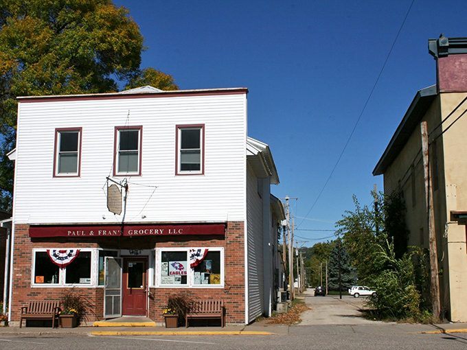 Paul & Franc Grocery stands as a charming reminder that small-town Wisconsin still values community over convenience. Those wooden benches invite you to sit and chat awhile.