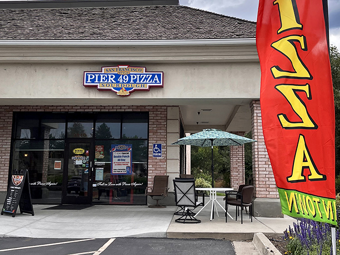 Pier 49's storefront might be modest, but that sourdough crust inside is showing off. The pizza flag waves proudly!