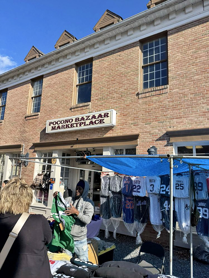 Pocono Bazaar's brick facade houses a world of wonders, where sports jerseys flutter like flags announcing bargain territory ahead.