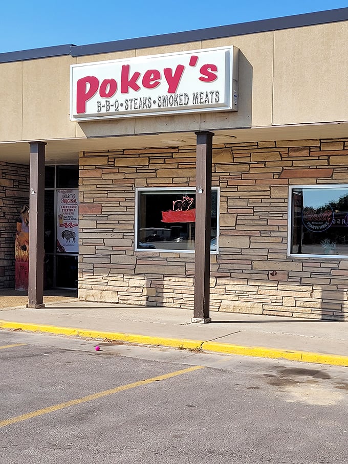 Stone front, straightforward sign - Pokey's lets their smoked meats do the talking, not fancy decorations.