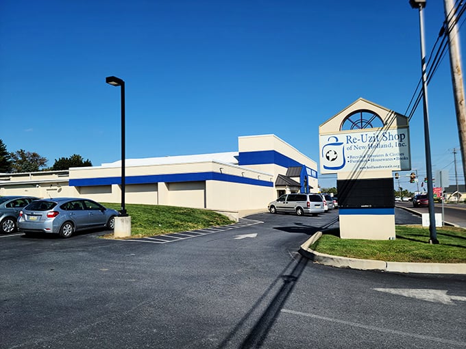 Re-Uzit Shop's blue-trimmed entrance offers a portal to Mennonite-curated treasures and community-supporting bargains.