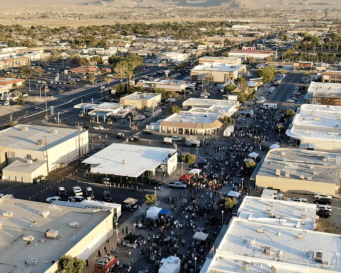 Aerial view of Ridgecrest's bustling community event, with desert mountains creating a stunning backdrop for this affordable retirement haven.