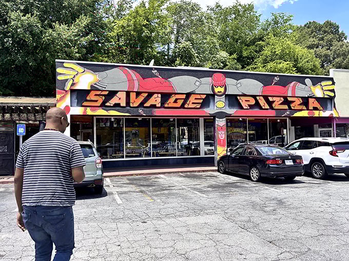 Savage Pizza's comic book facade is like walking into a delicious alternate universe where superheroes make incredible pies.