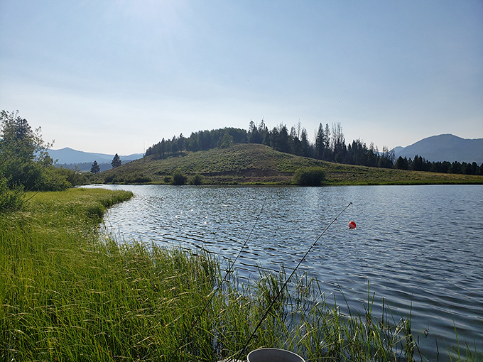 Fishing paradise with a view! Steamboat Lake's peaceful waters reflect Colorado's majestic mountains like nature's perfect mirror.