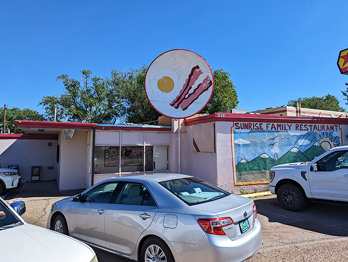 That cheerful bacon-and-egg sign promises exactly what your morning soul is craving most.