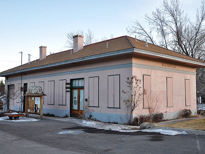 Susanville's historic pink building with shutters represents small-town charm where local businesses keep prices reasonable.