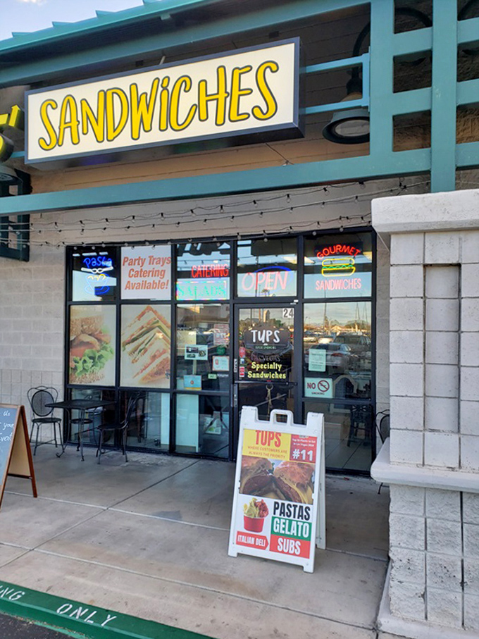 TUPS' bright yellow "SANDWICHES" sign cuts through Vegas visual noise with a simple promise: gourmet handheld happiness.