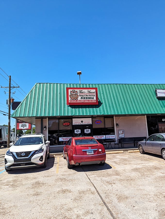 That's Amore's bright sign promises both Chicago AND New York style pizza &ndash; a diplomatic solution to the great pizza debate!