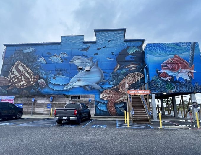 The Reef's stunning ocean mural gives you a preview of what's swimming on your plate inside.