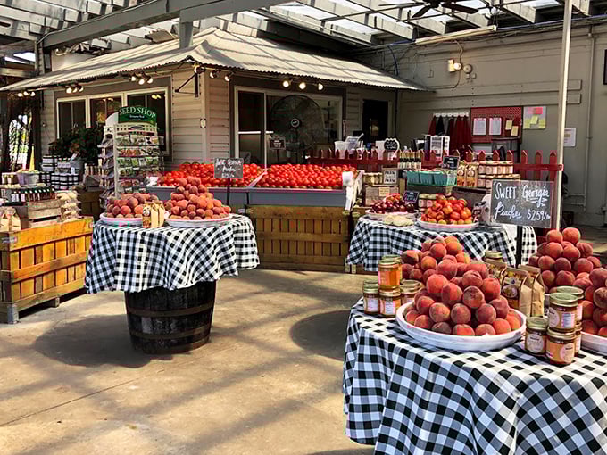 The Witten Farm Market's peach display is summer captured in fuzzy, juicy form. Those checkered tablecloths aren't just decorative&mdash;they're a promise of homegrown goodness!