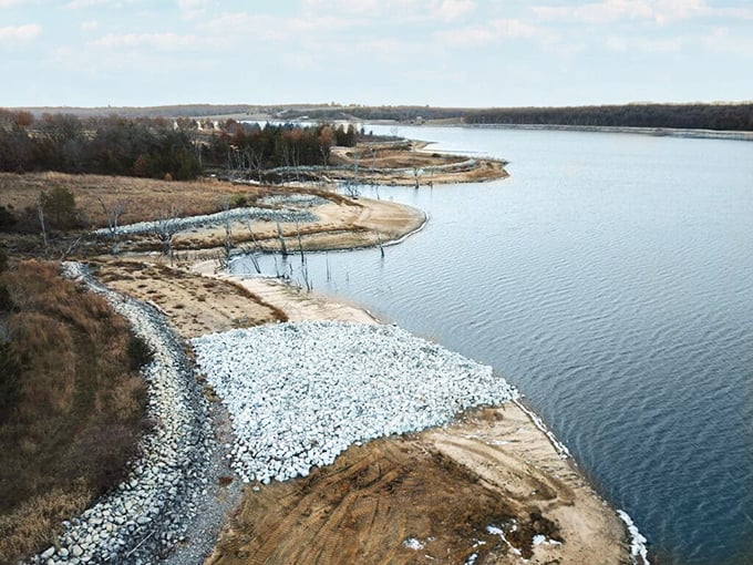Dramatic skies frame this tranquil beach where nature puts on its most spectacular evening show.