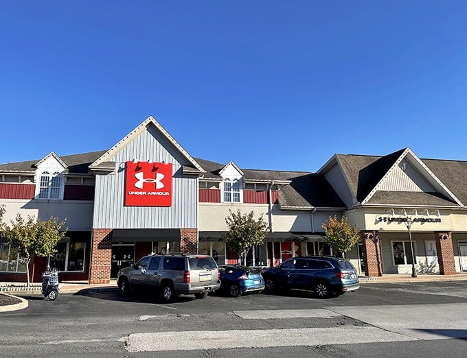 Under Armour's bold red sign stands out against blue skies at The Outlet Shoppes at Gettysburg&mdash;athletic wear at prices that won't start a civil war.