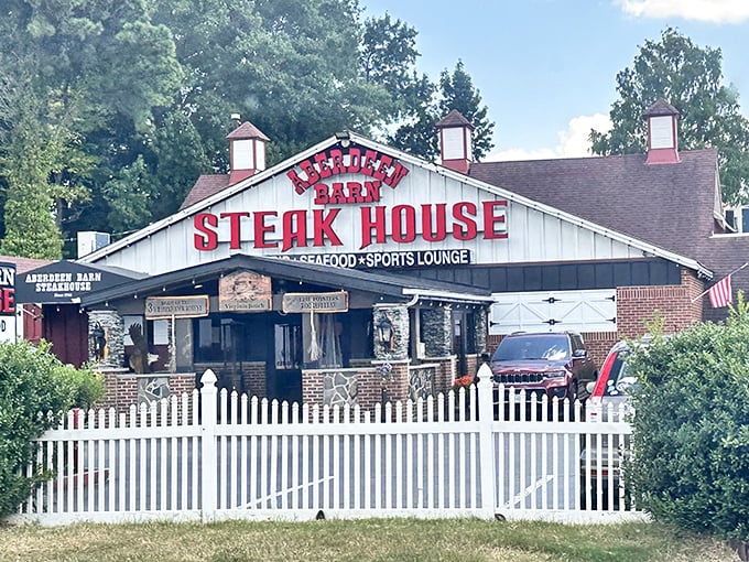 The white picket fence says "charming country dining," but those red letters scream "serious about steak!"