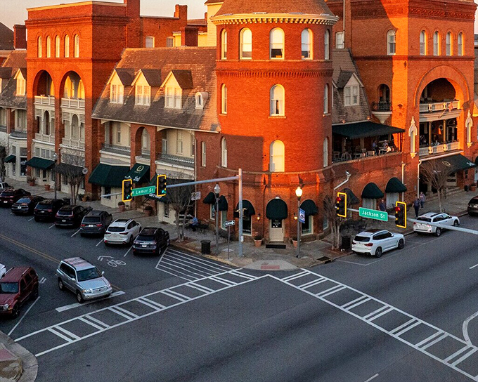 The Windsor Hotel in Americus rises like a Victorian dream against the Georgia sky, a grand dame with stories to tell.