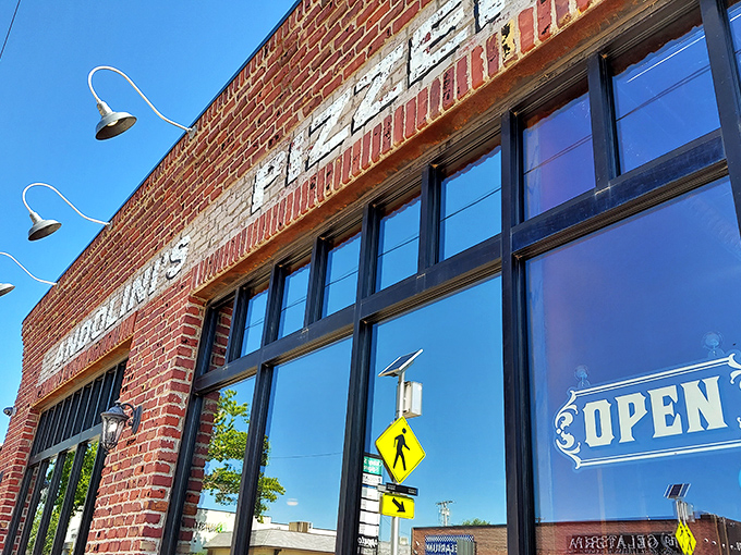 The "OPEN" sign is just a formality—the real invitation is the aroma of perfect pizza wafting through Tulsa's Cherry Street.