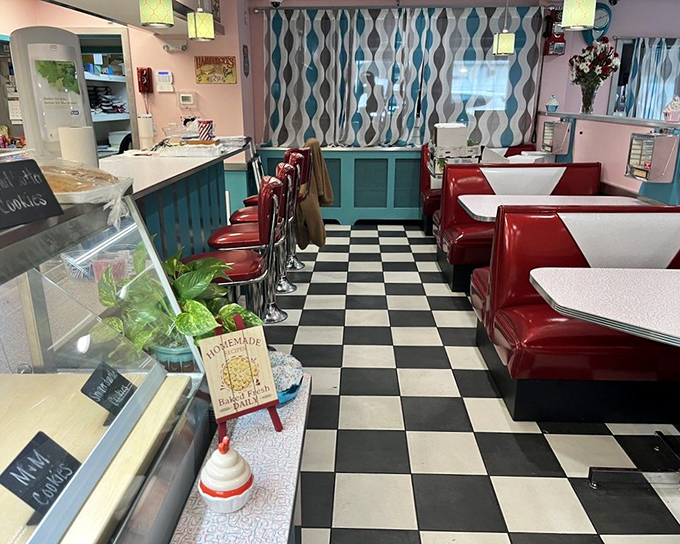 Step into this retro diner dreamland where checkered floors and turquoise accents set the stage for serious pie drama.