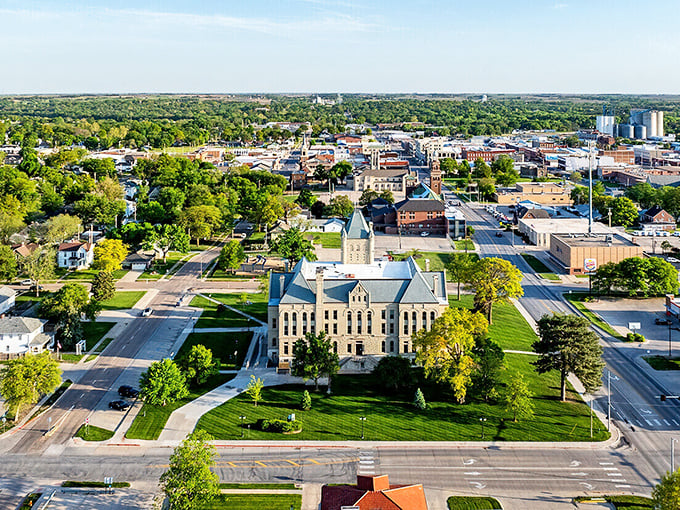 The sun casts a golden glow on Beatrice's downtown, highlighting brick buildings that have stood the test of time&mdash;just like your retirement savings will here.