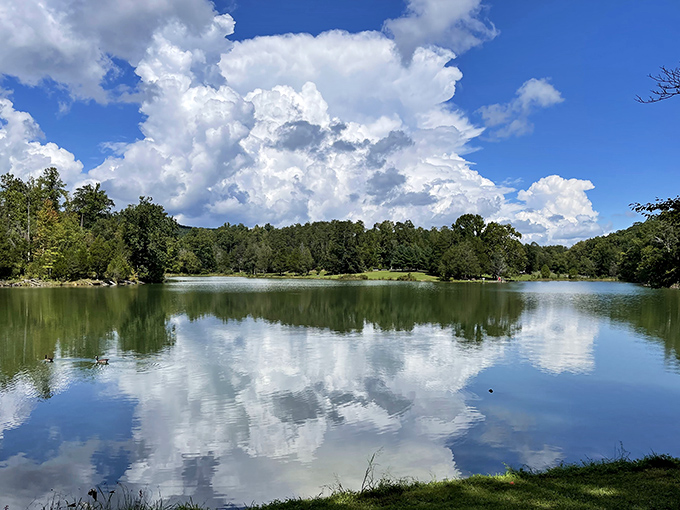 Puffy clouds play hide-and-seek with their reflections in a lake so pristine it looks Photoshopped by Mother Nature herself.