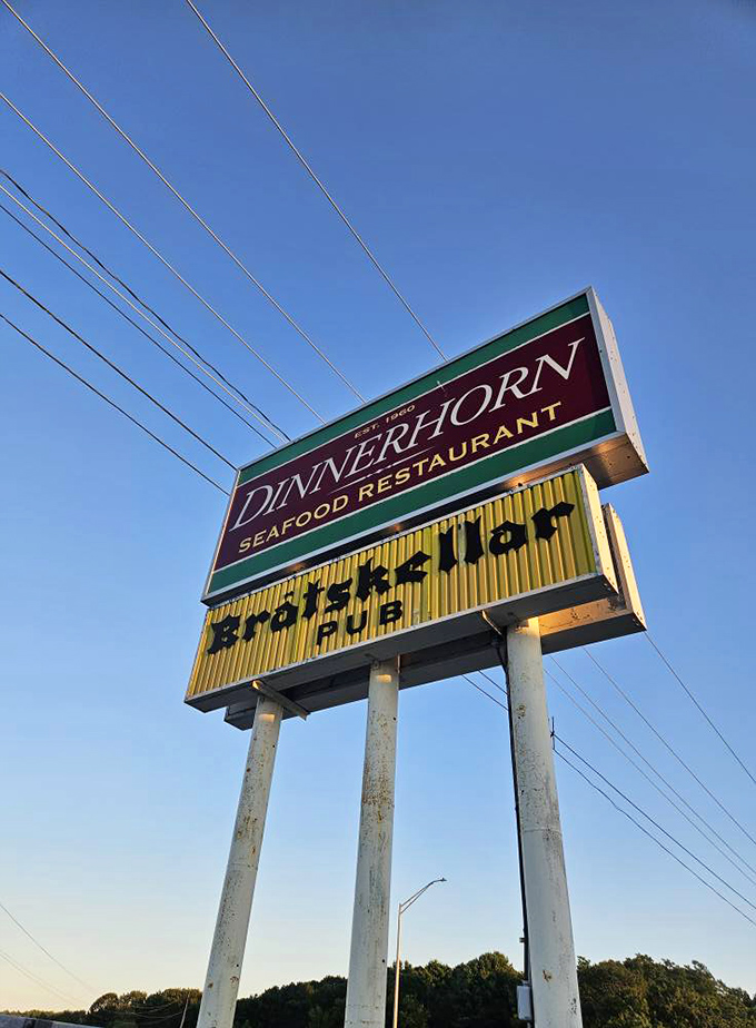 The Bratskellar sign stands tall against Portsmouth skies, a siren call to those who appreciate pizza with personality.