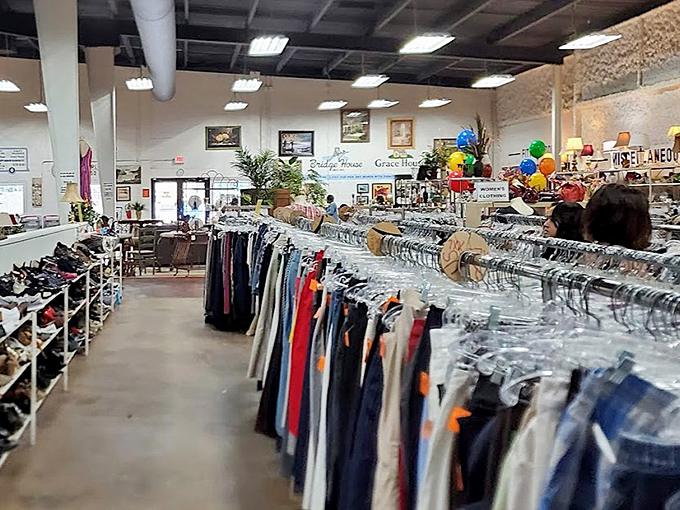 Racks stretch like a clothing rainbow through this organized paradise, where every aisle promises a new discovery adventure.