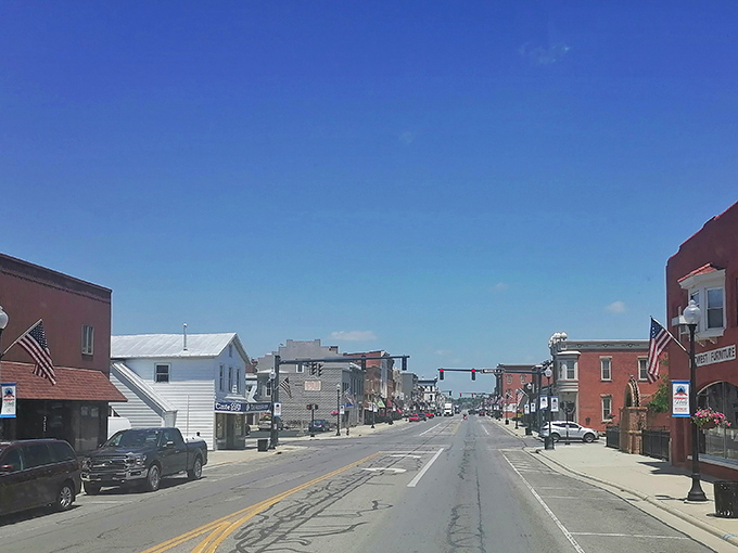 Wide main street stretches toward horizons filled with possibilities and budget-friendly retirement dreams.