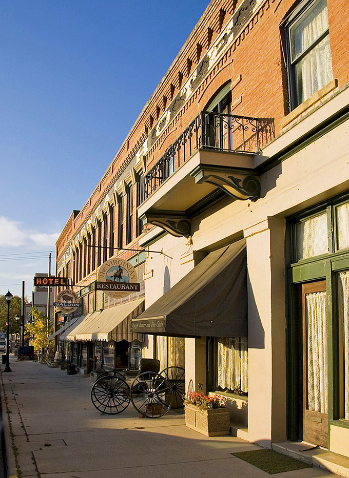 The Occidental Hotel's elegant facade glows in golden afternoon light, its wrought-iron balconies whispering tales of Buffalo's colorful past.