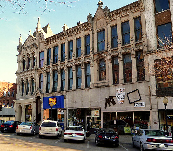 Historic white building meets modern affordability in Burlington, where these storefronts house budget-friendly shops and services.